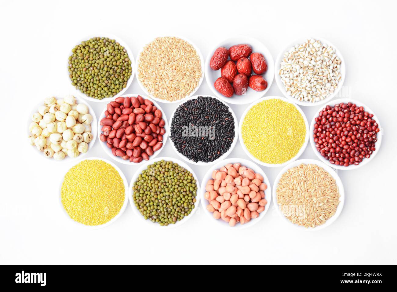 A variety of raw cereals of different colors and types presented in ...