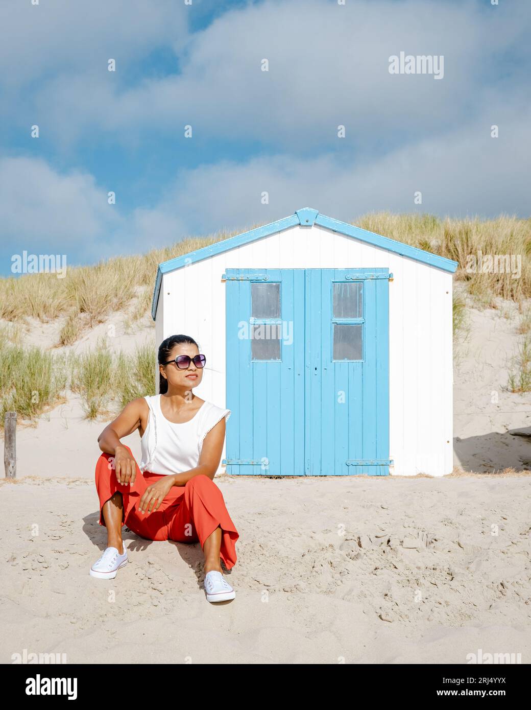 Asian women visiting the beach of Texel with on the background the ...
