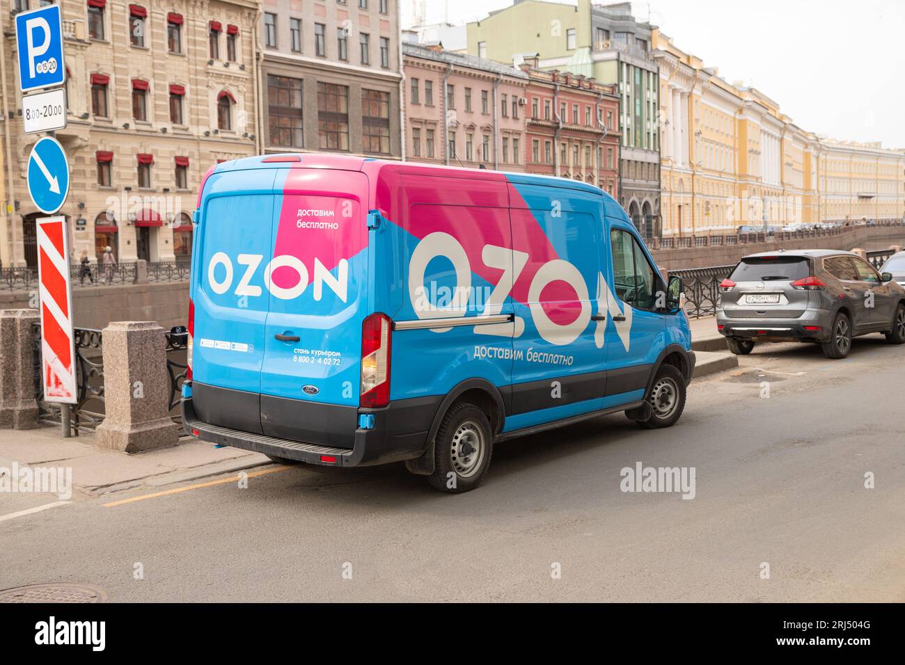 Ozon logo sign on mini van truck on street of European city. branded ...