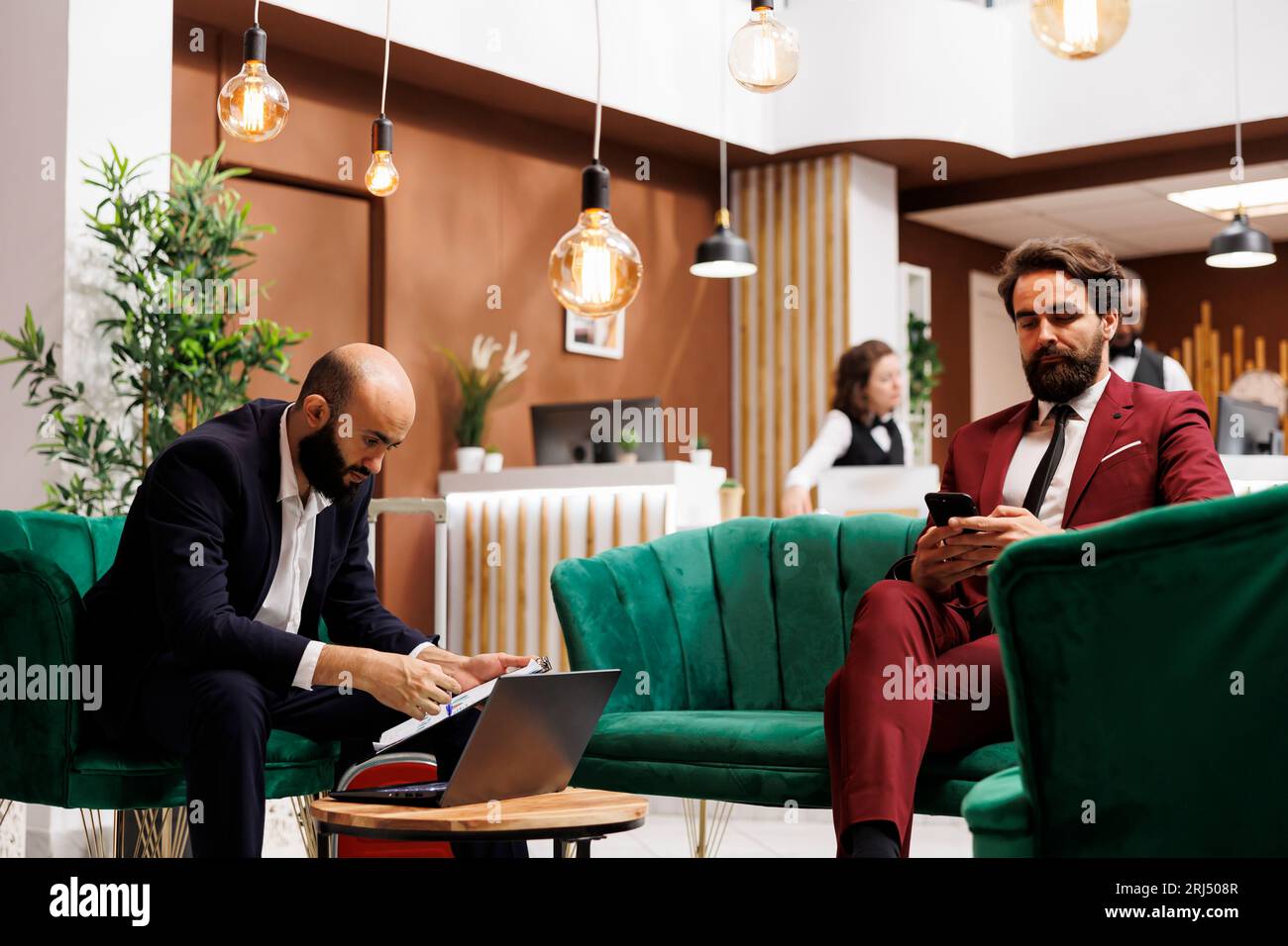 Businessman woman sitting reception desk hi-res stock photography and ...