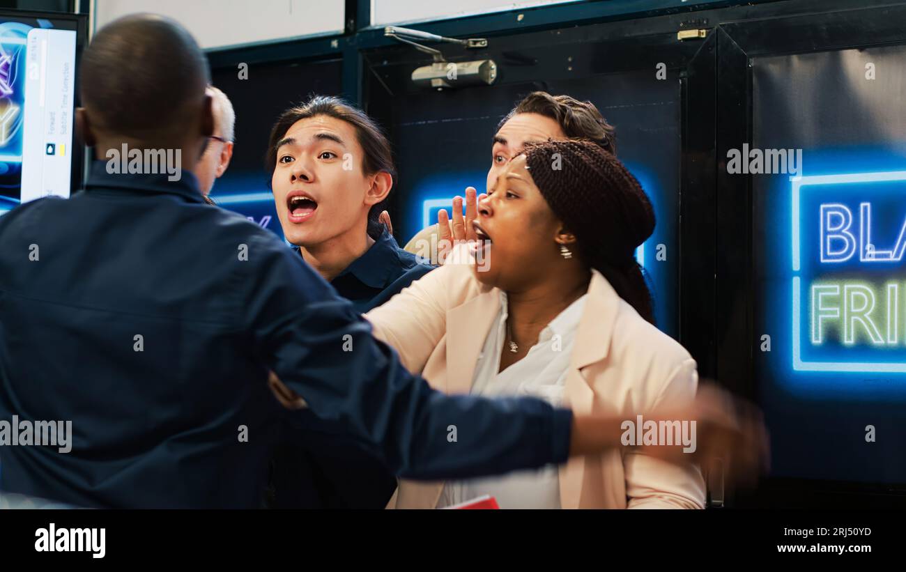 Mad diverse shoppers at store entrance going crazy for Black Friday promotions and deals ...
