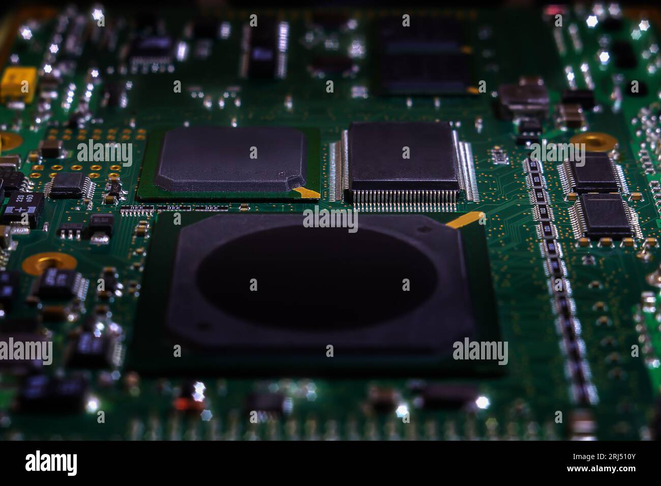 Intricate circuit board with computer hardware, showcasing complexity ...