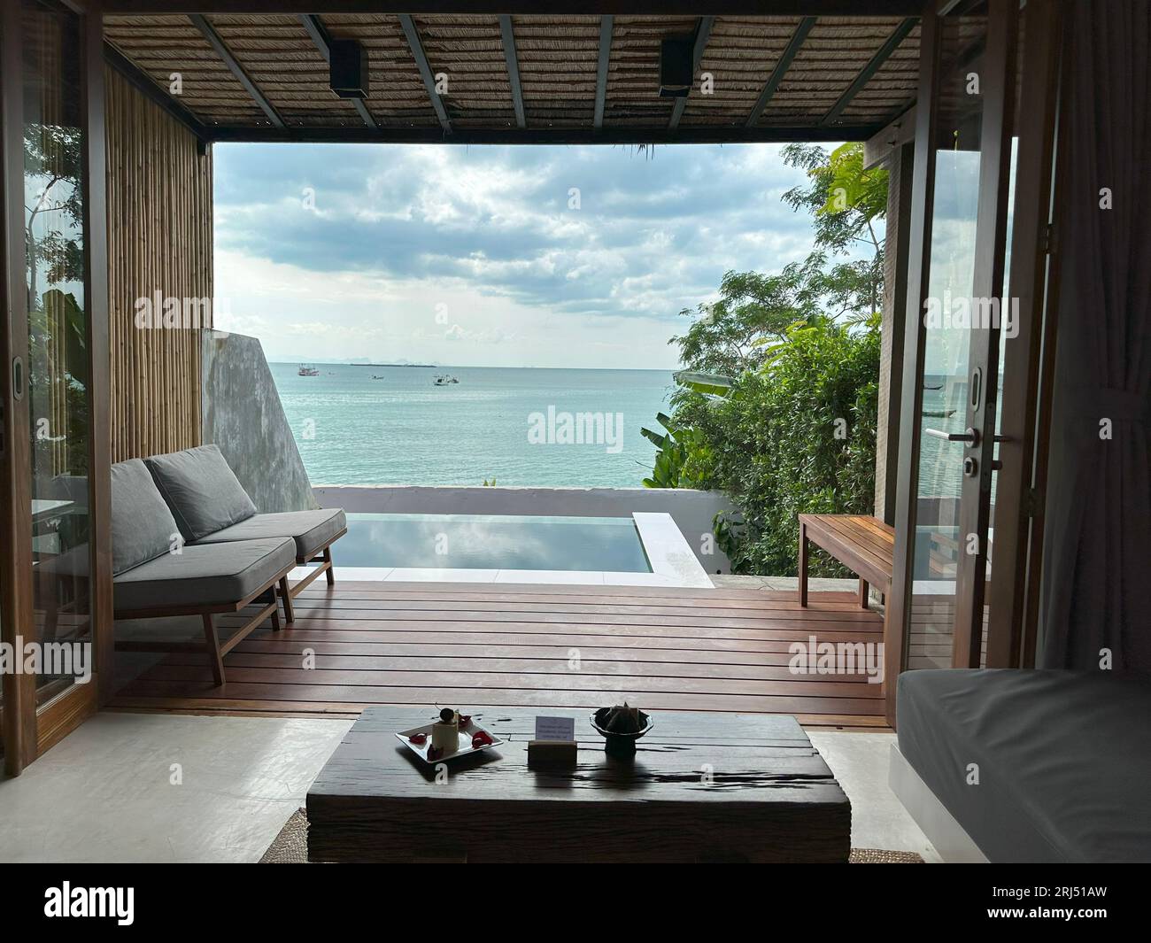 A room overlooking an ocean landscape, complete with a comfortable ...