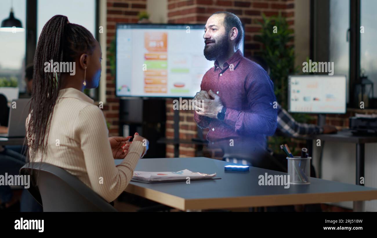 Worker watching augmented reality training video visualization of team ...