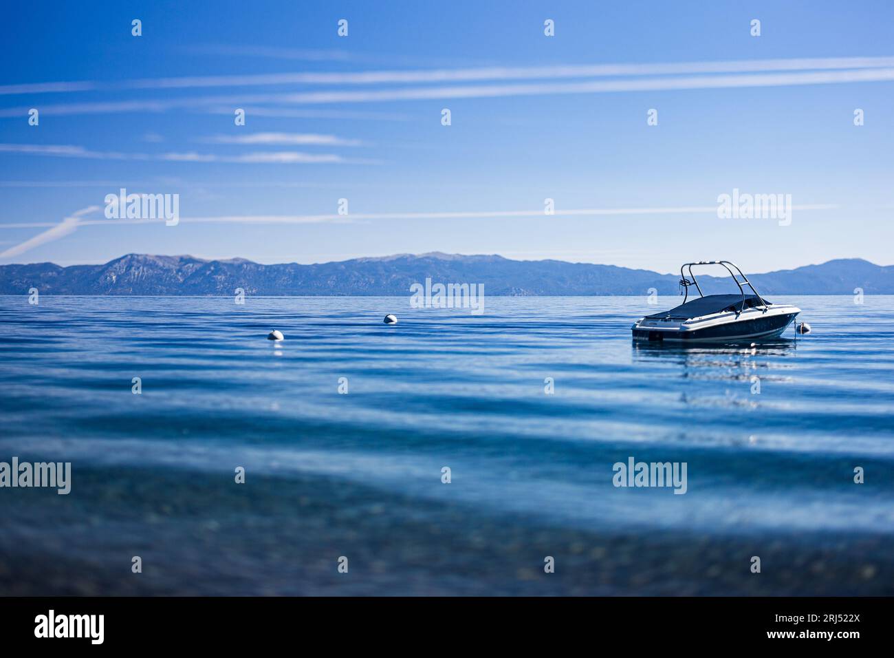 Wakeboard motorboat on Lake Tahoe California, reflections, tilt-shift ...