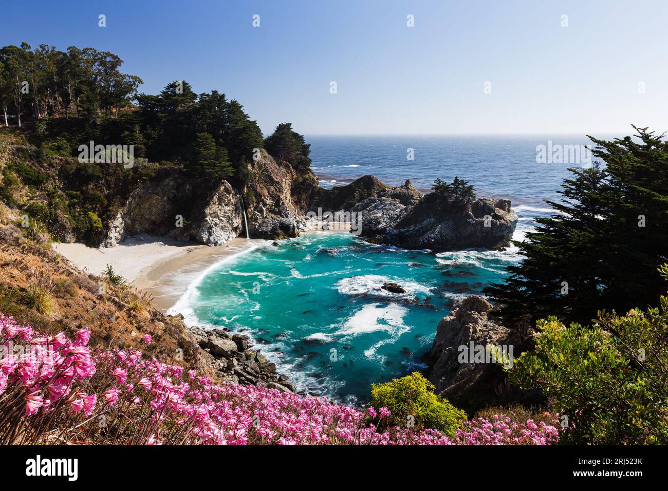 Landscape of Big Sur waterfall in California along Route 1, with blue ...