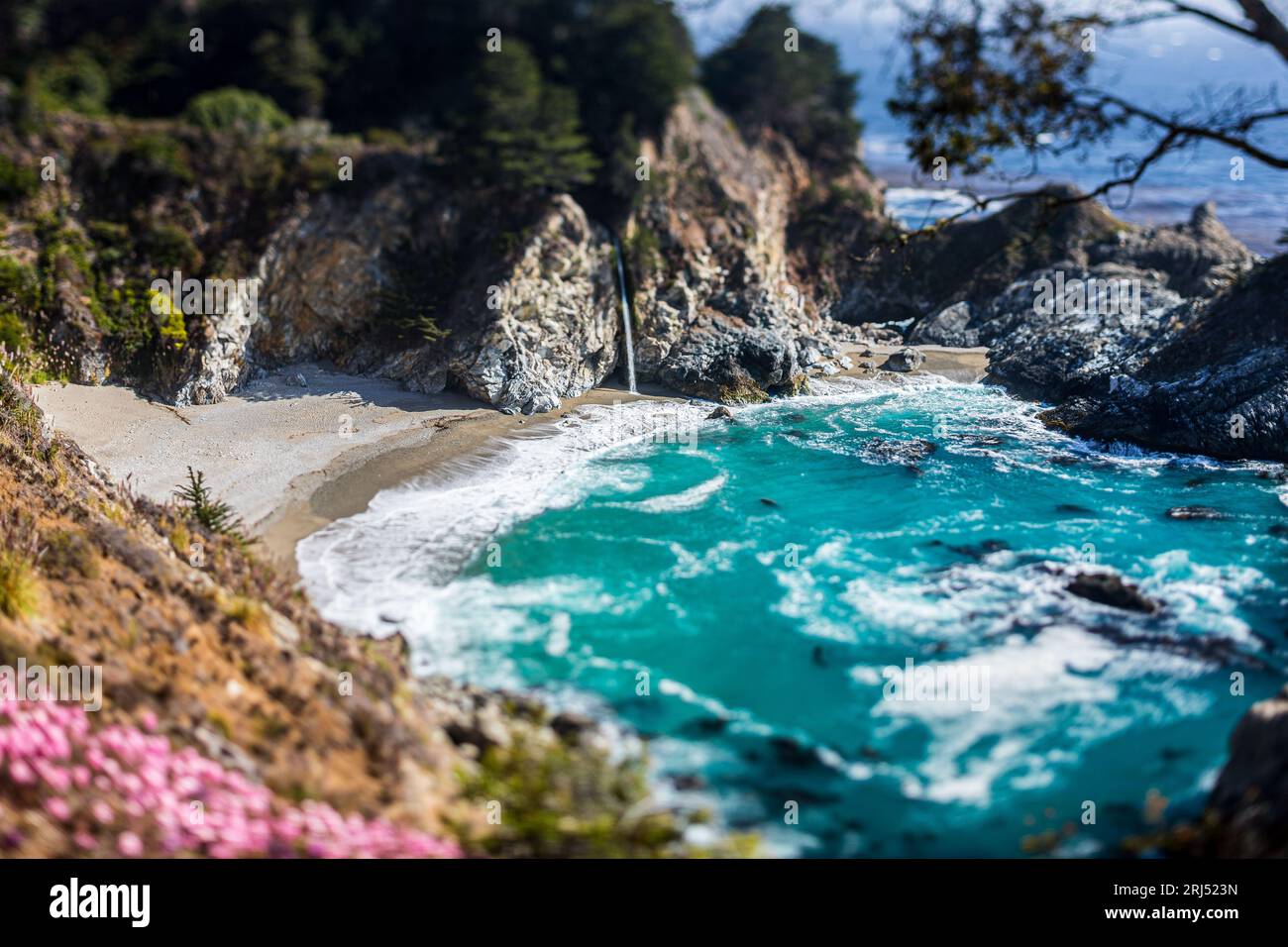 Landscape of Big Sur waterfall in California along Route 1, with blue ...
