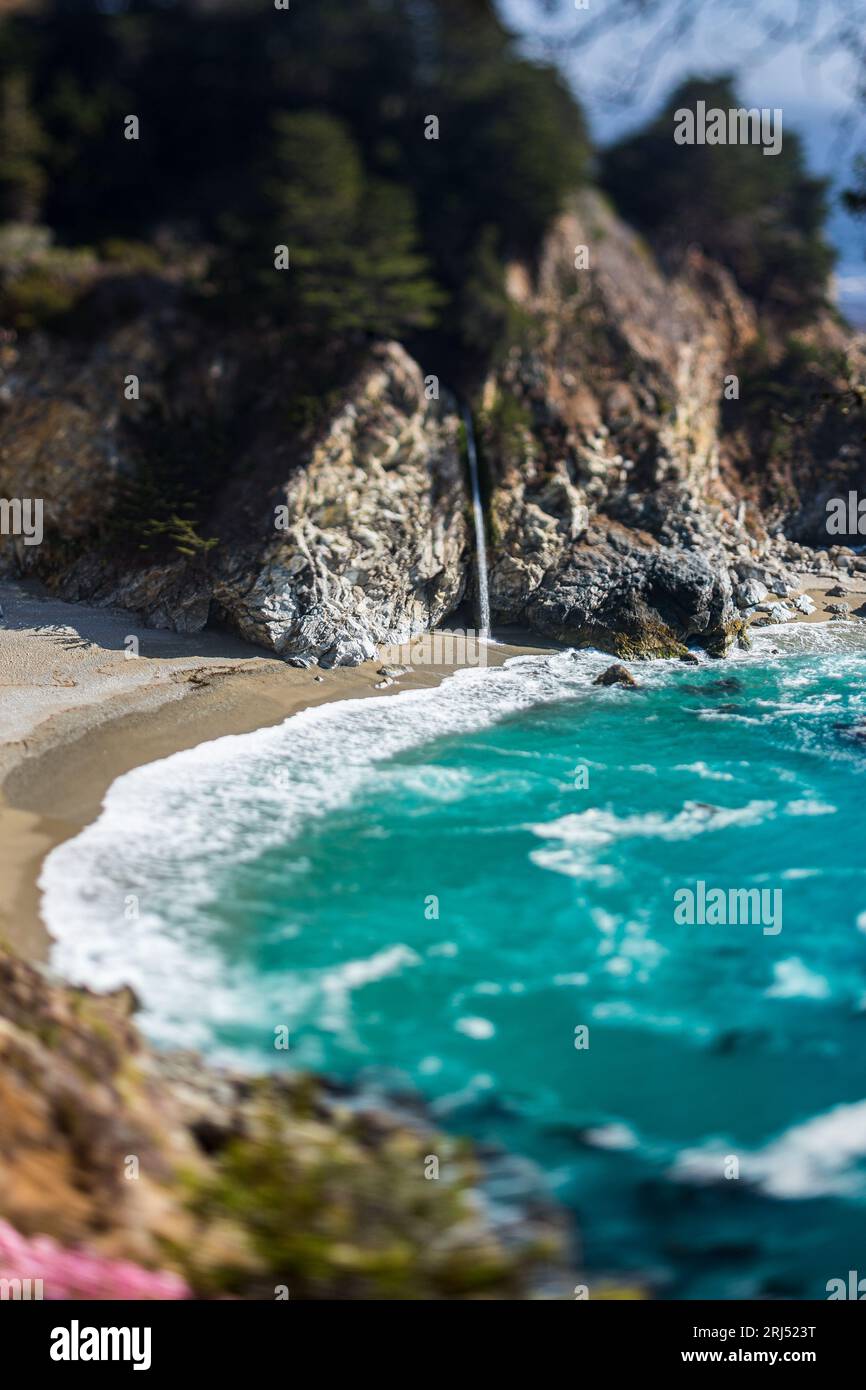 Landscape of Big Sur waterfall in California along Route 1, with blue ...