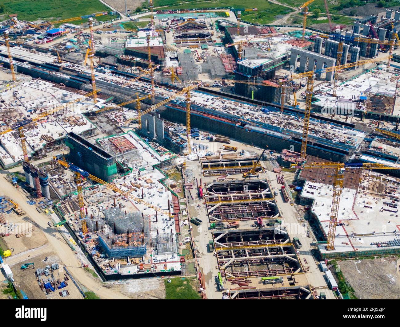 SUZHOU, CHINA - AUGUST 19, 2023 - Tower cranes stand at the ...