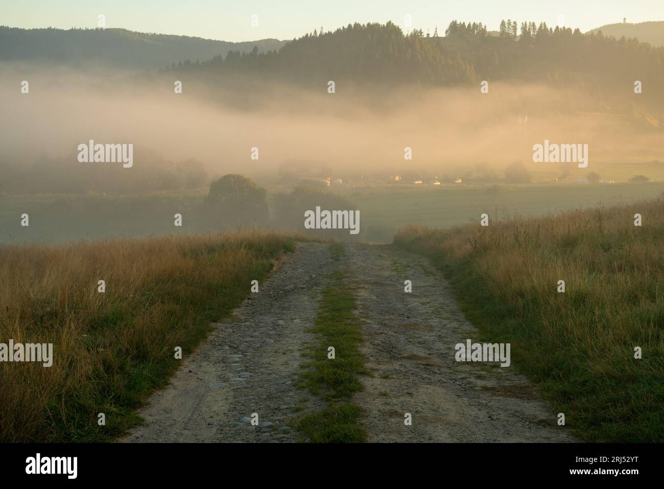 Mountainous gravel road with depth of field Stock Photo - Alamy