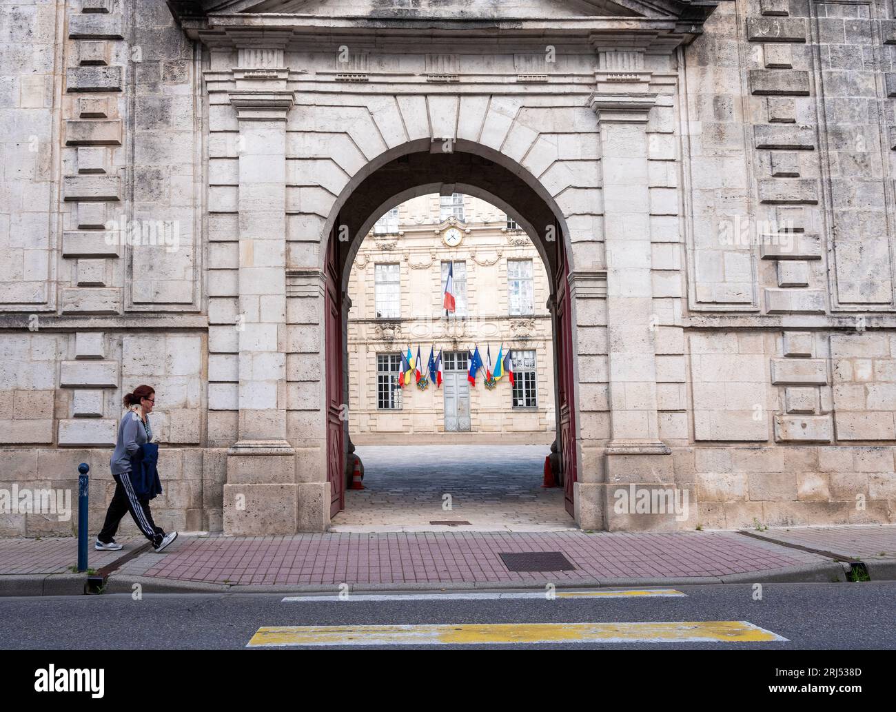 town hall of verdun with flags seen through arch Stock Photo - Alamy