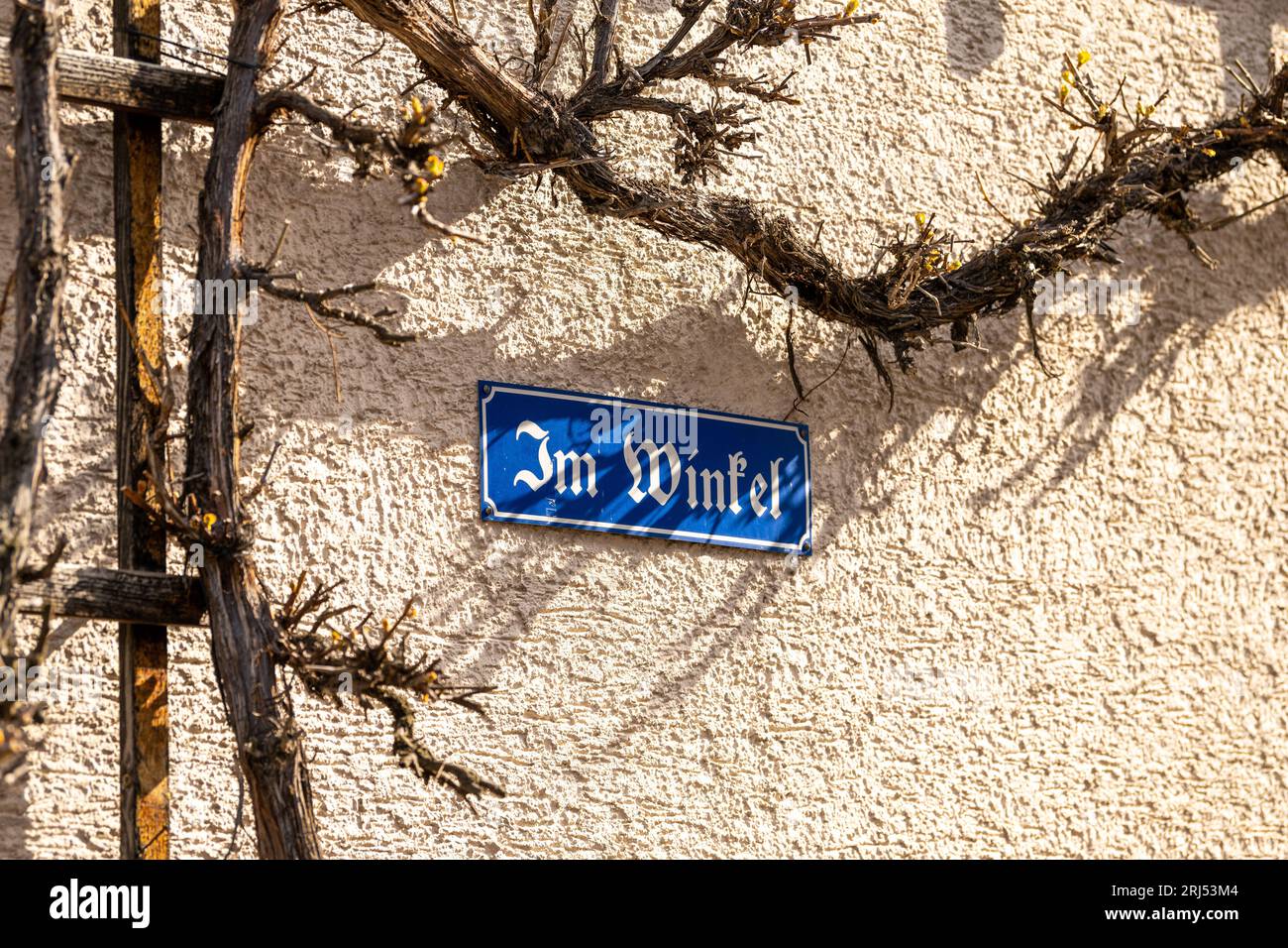 Old street sign, blue, Im Winkel, in old German letters on the wall of ...