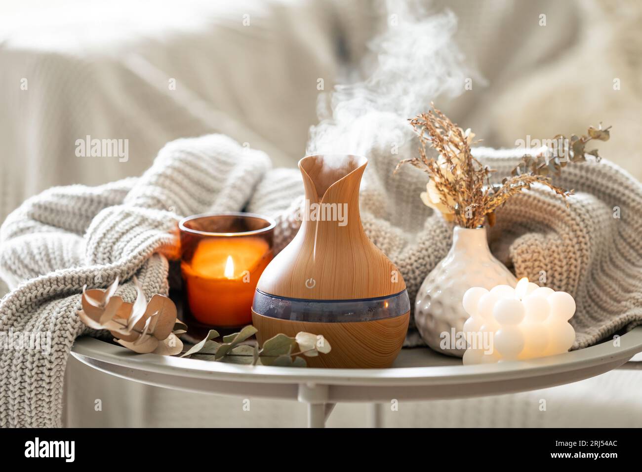 Aroma composition with a modern aroma oil diffuser and a knitted ...