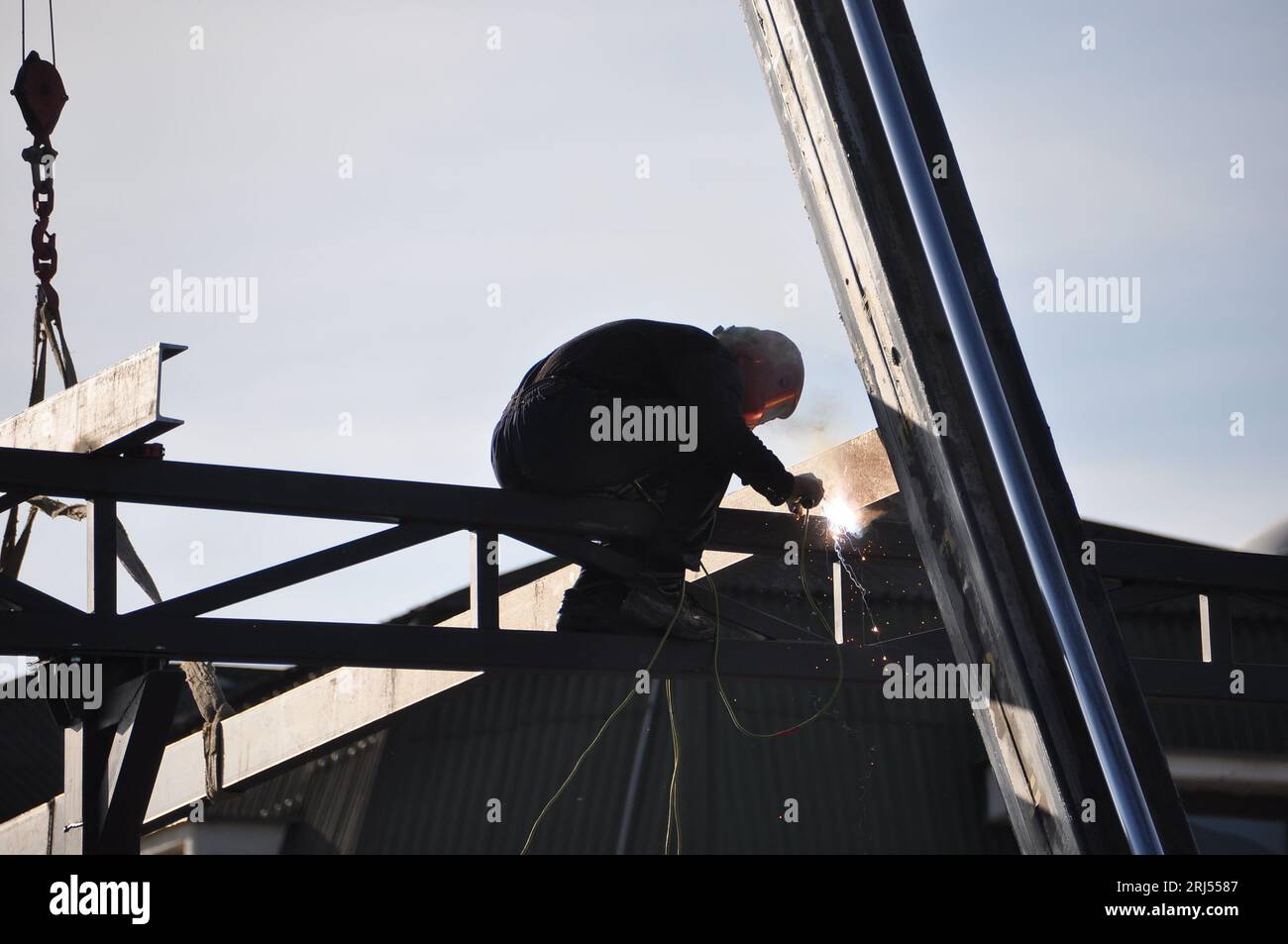 Person with yellow jacket hi-res stock photography and images - Alamy