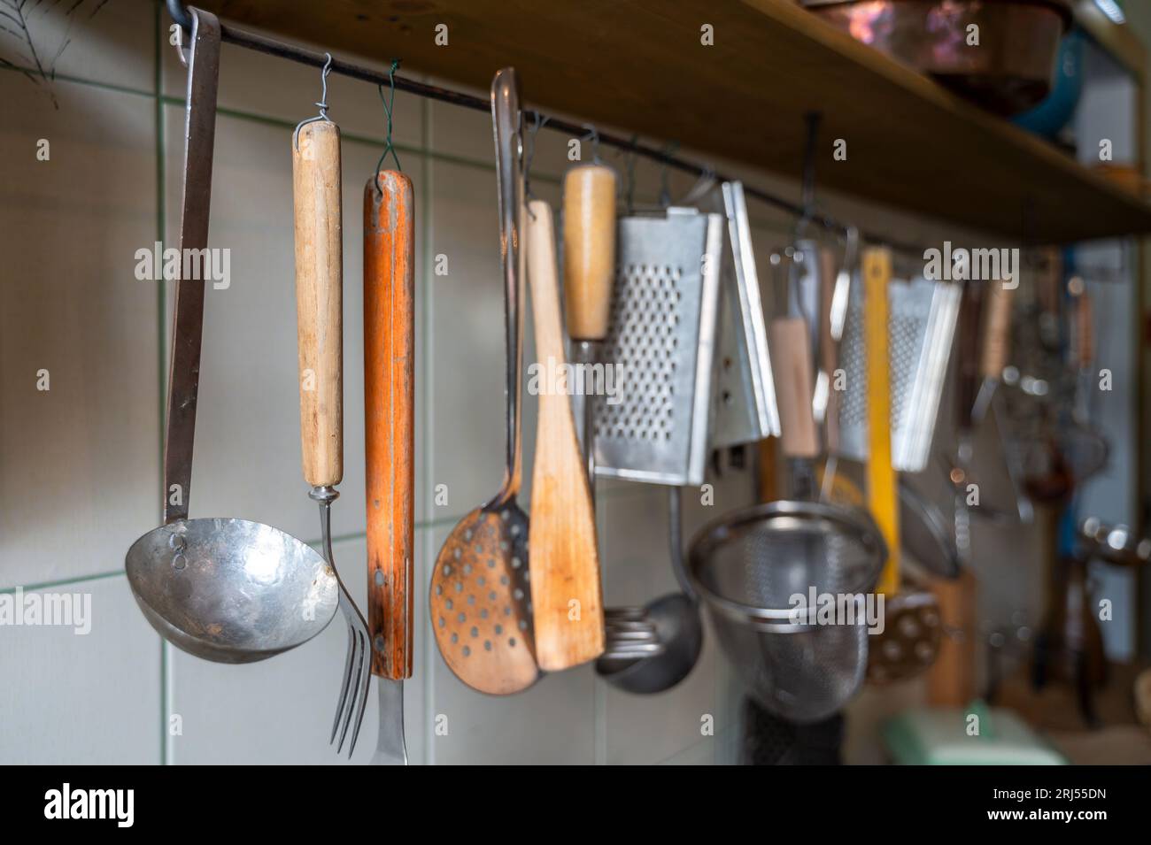 Old kitchen wooden metal utensils on rack Stock Photo - Alamy