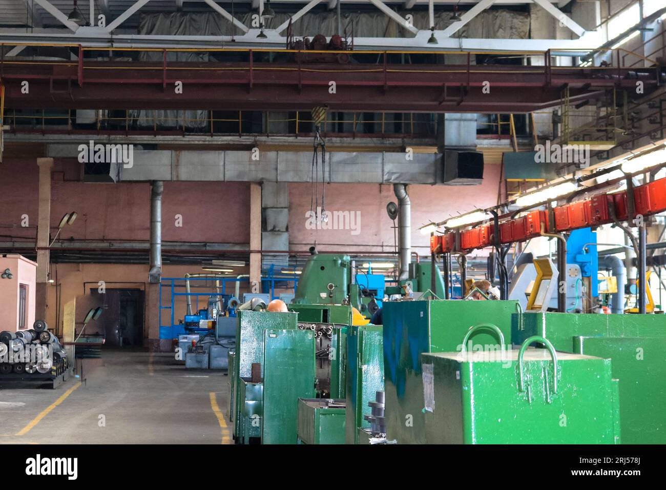 A large industrial workshop inside the building with machine tools and ...