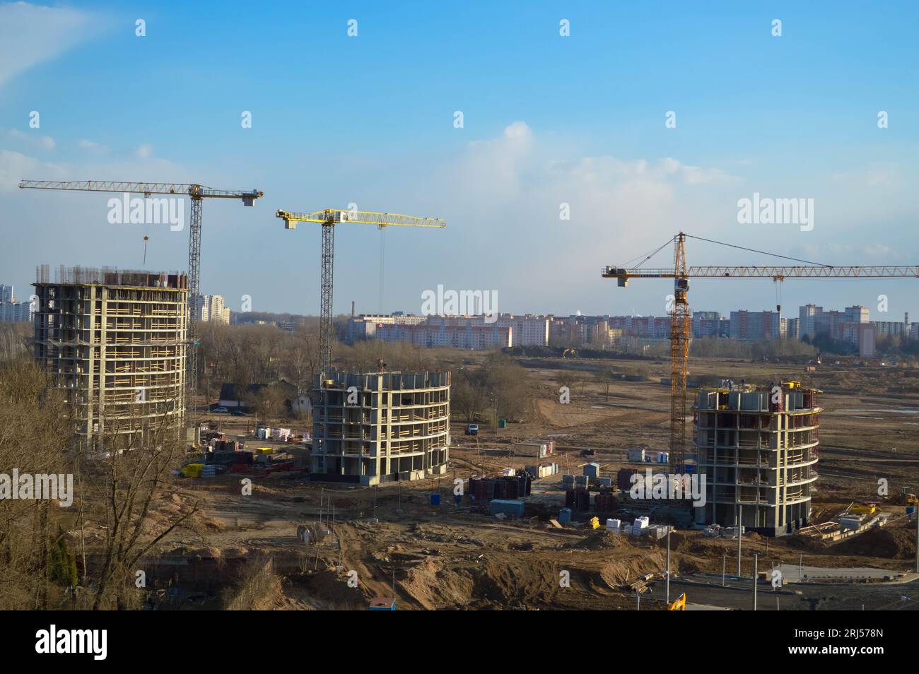 Top view of a large construction site with cranes and buildings houses ...