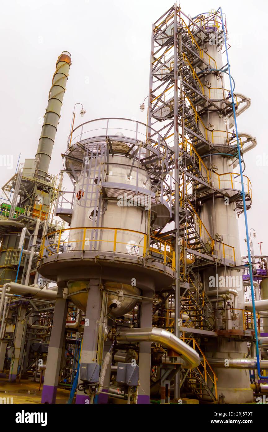 Installation for processing oil with columns and pipes. Refinery. Oil ...