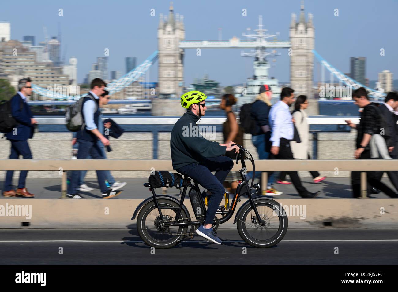 A man riding a RadRunner electric bicycle by Rad Power Bikes during the evening rush hour across ...