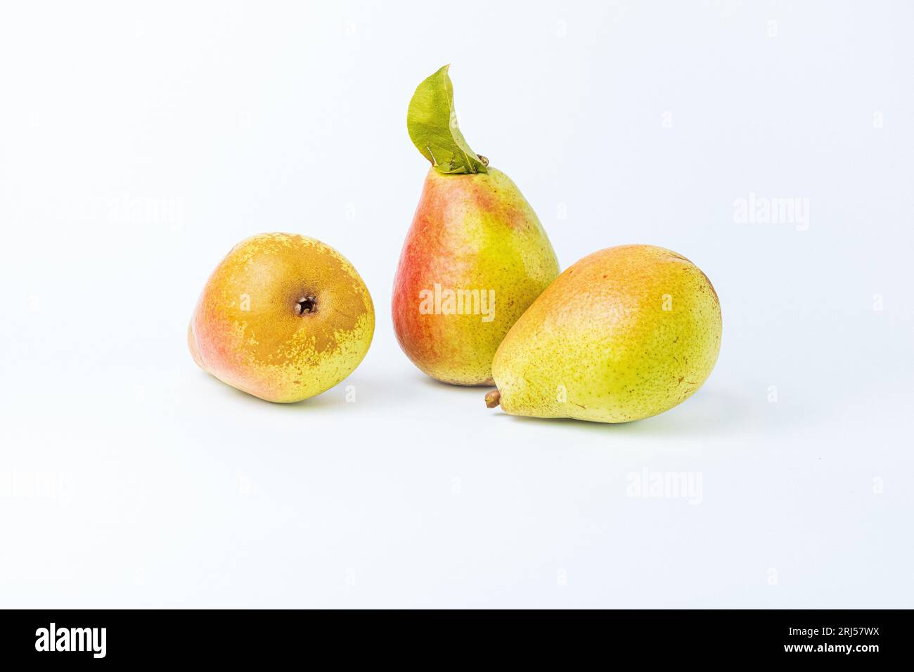 Three ripe pears against a white background Stock Photo - Alamy