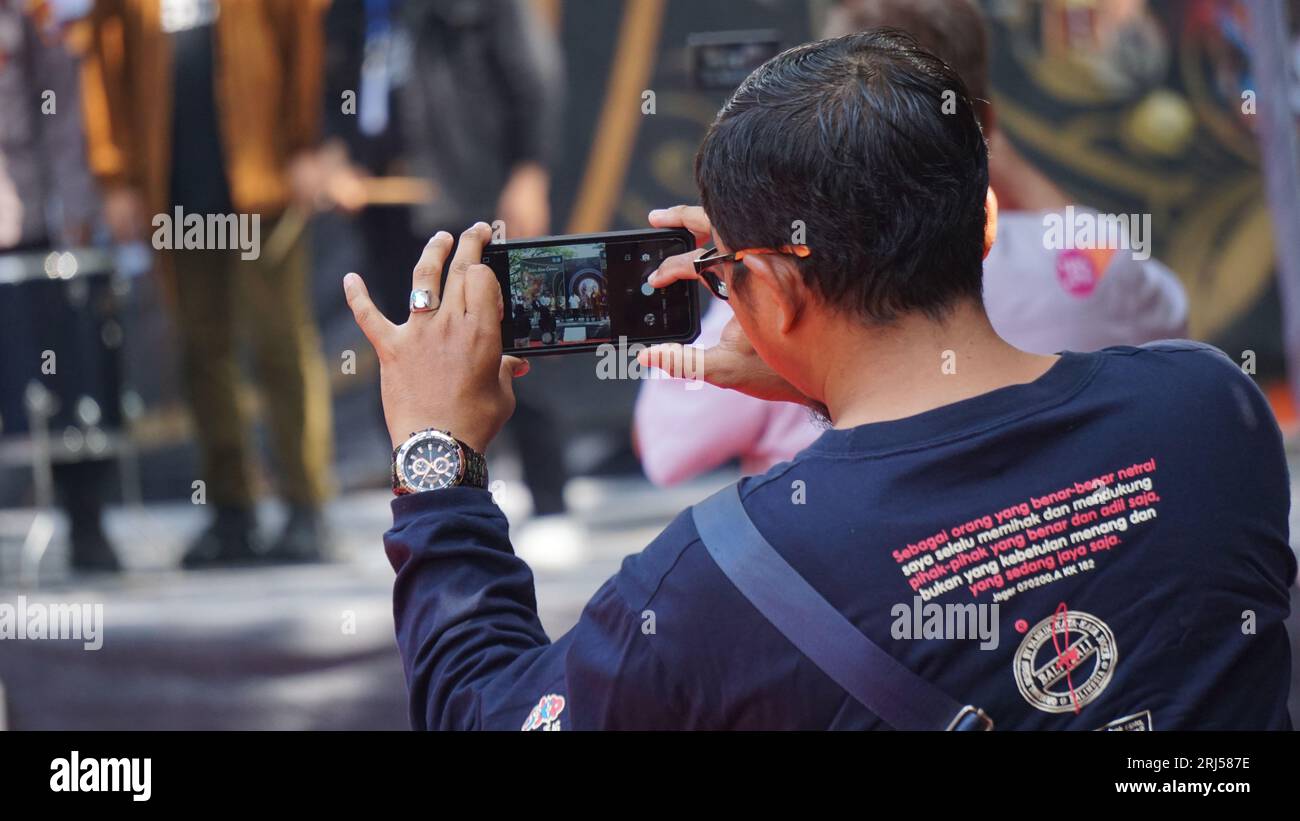 People take a picture with smartphone Stock Photo - Alamy