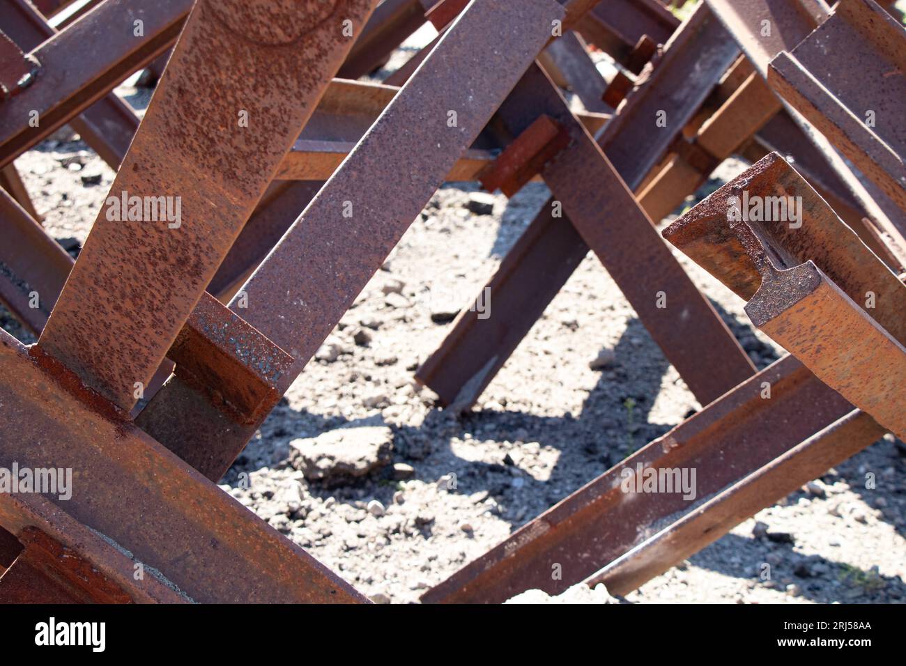 Anti-tank hedgehogs stand on the road in the city of Dnipro in Ukraine ...