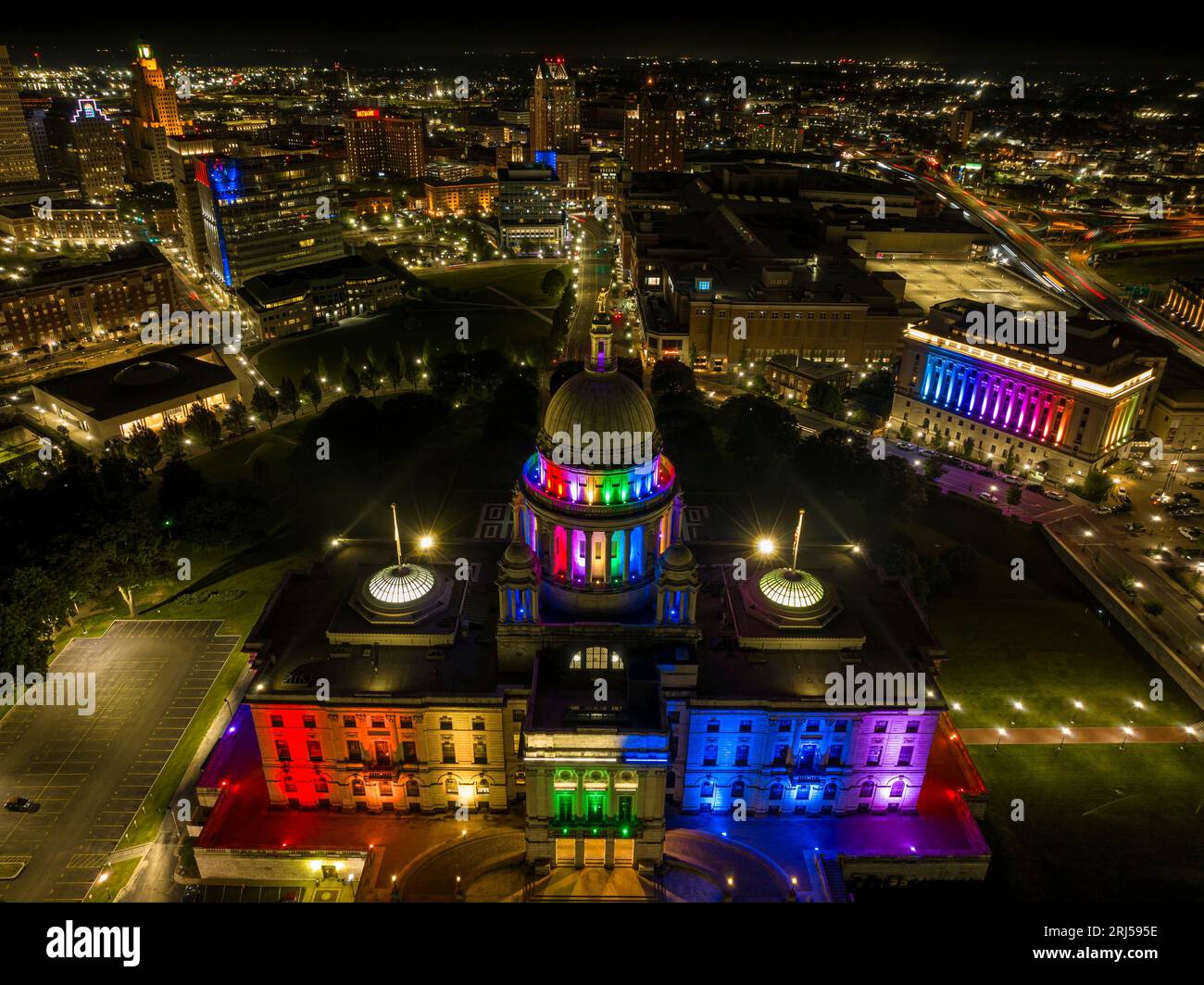 An aerial view of the illuminated Providence RI State House in rainbow ...