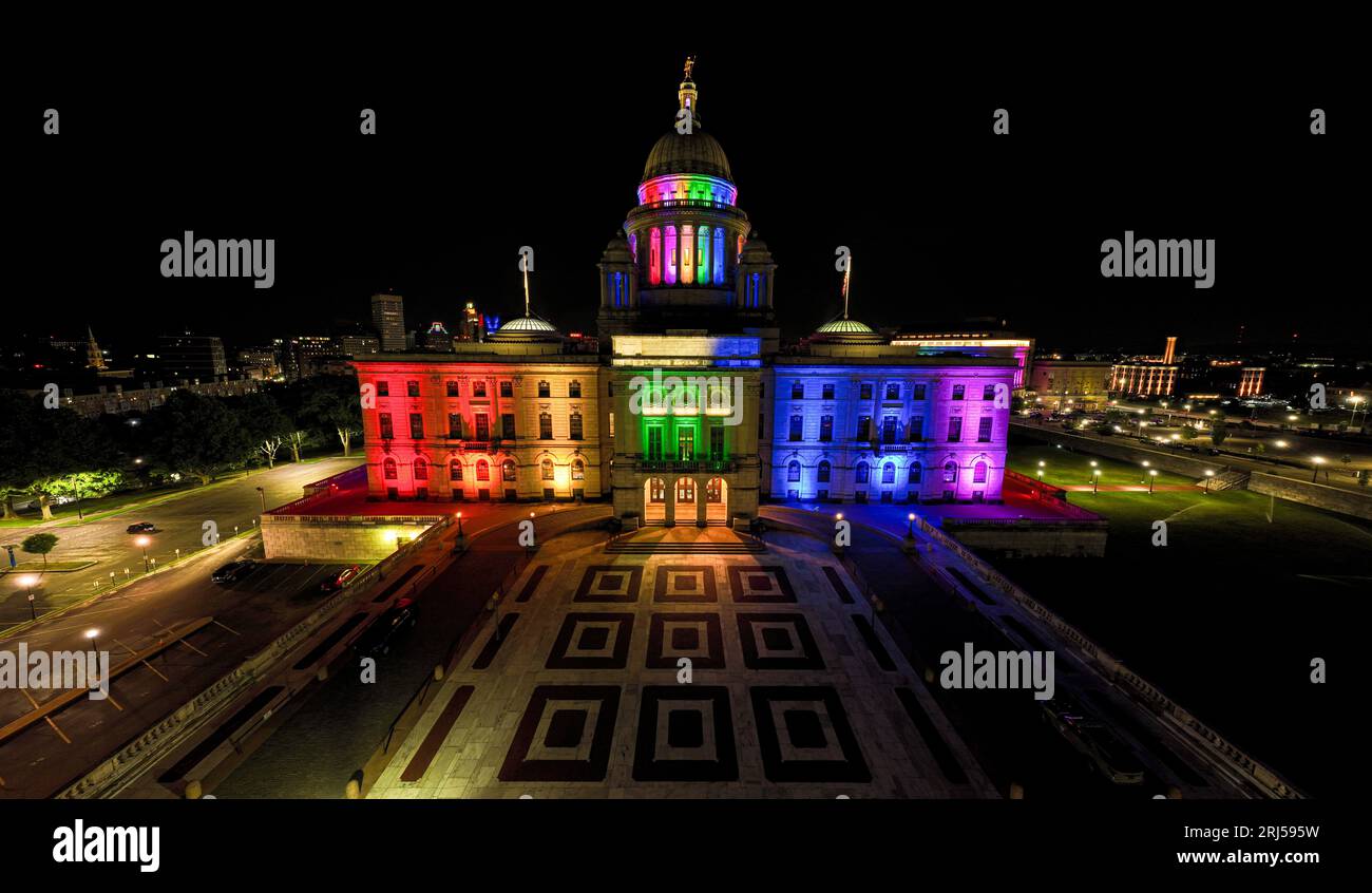 An aerial view of the illuminated Providence RI State House in rainbow ...