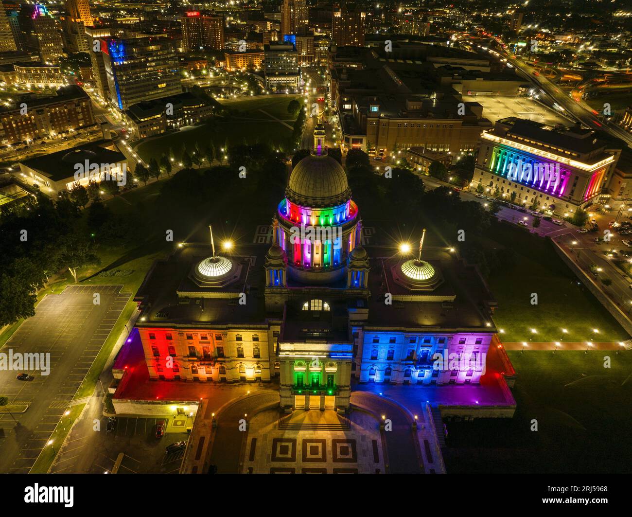 An aerial view of the illuminated Providence RI State House in rainbow ...
