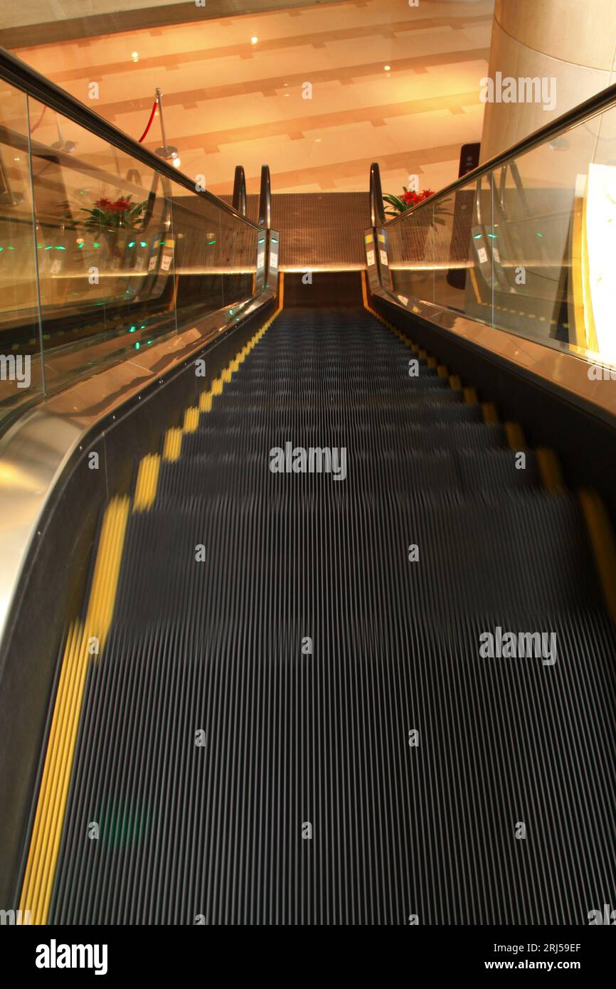 modern escalator in a hotel lobby, closeup of pictures Stock Photo - Alamy
