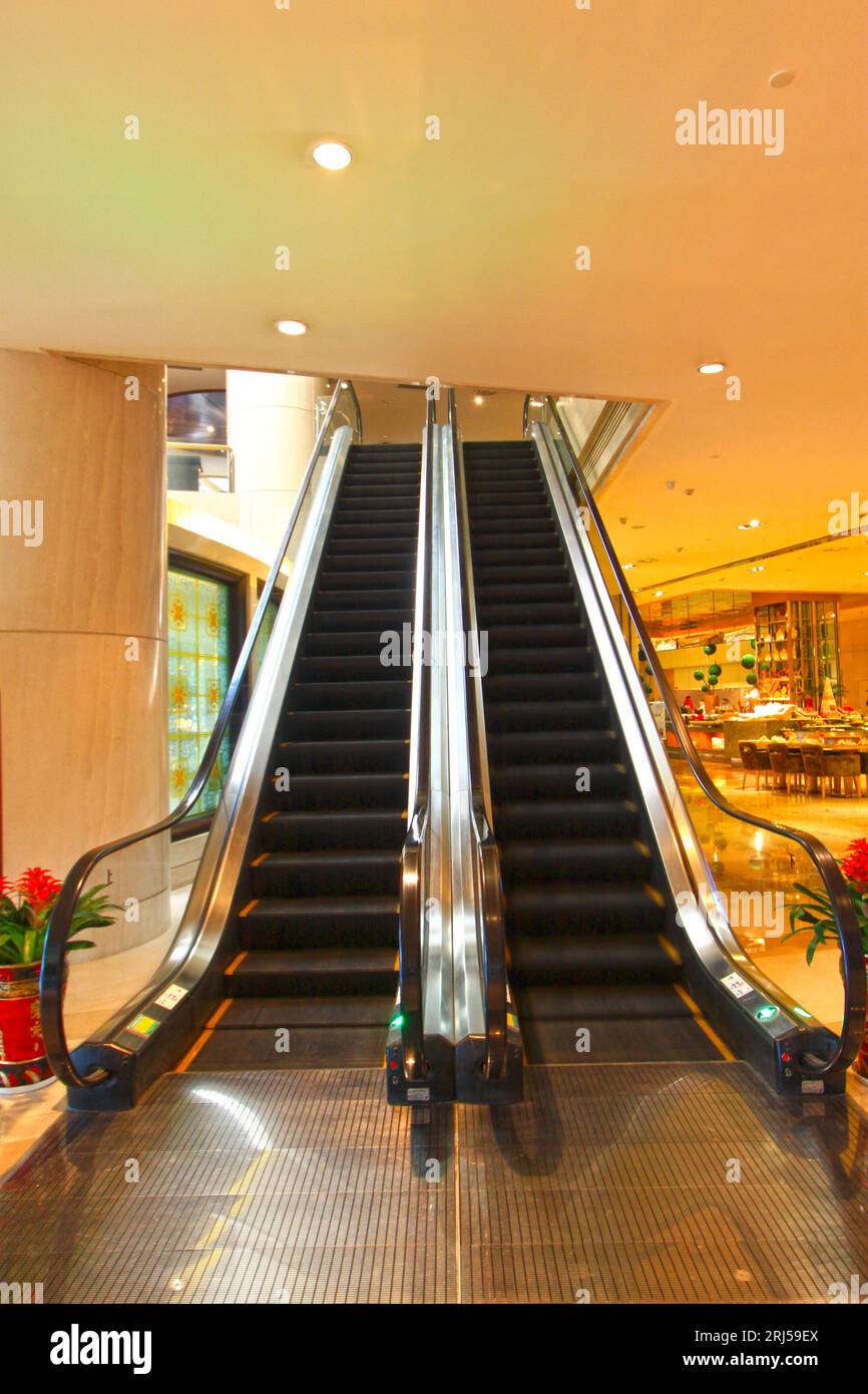modern escalator in a hotel lobby, closeup of pictures Stock Photo - Alamy