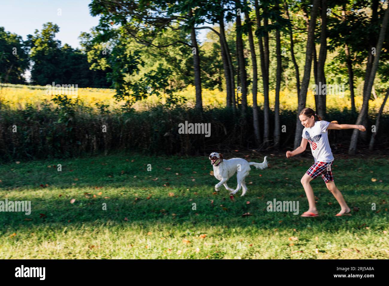 Child running in the yard hi-res stock photography and images - Alamy