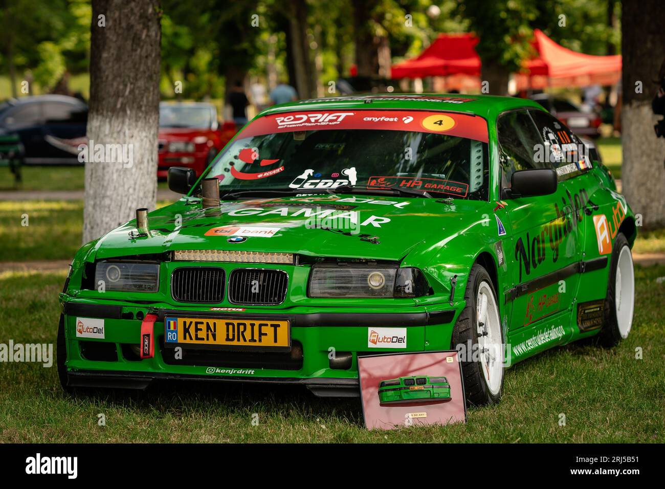A vintage green BMW car with different modifications at an Auto Tuning ...