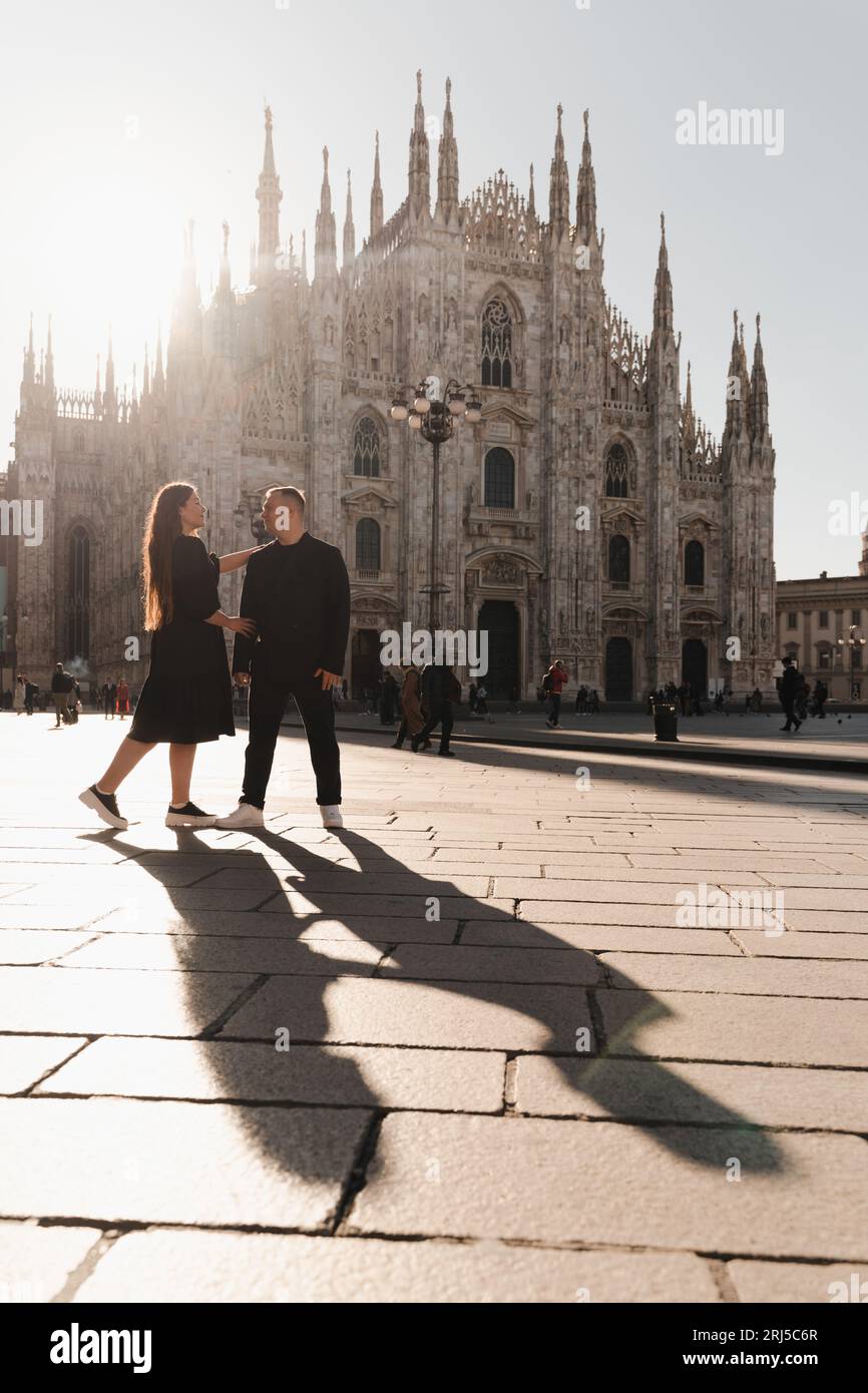 Romantic photo of lovers on the main square of Milan, backlight Stock ...