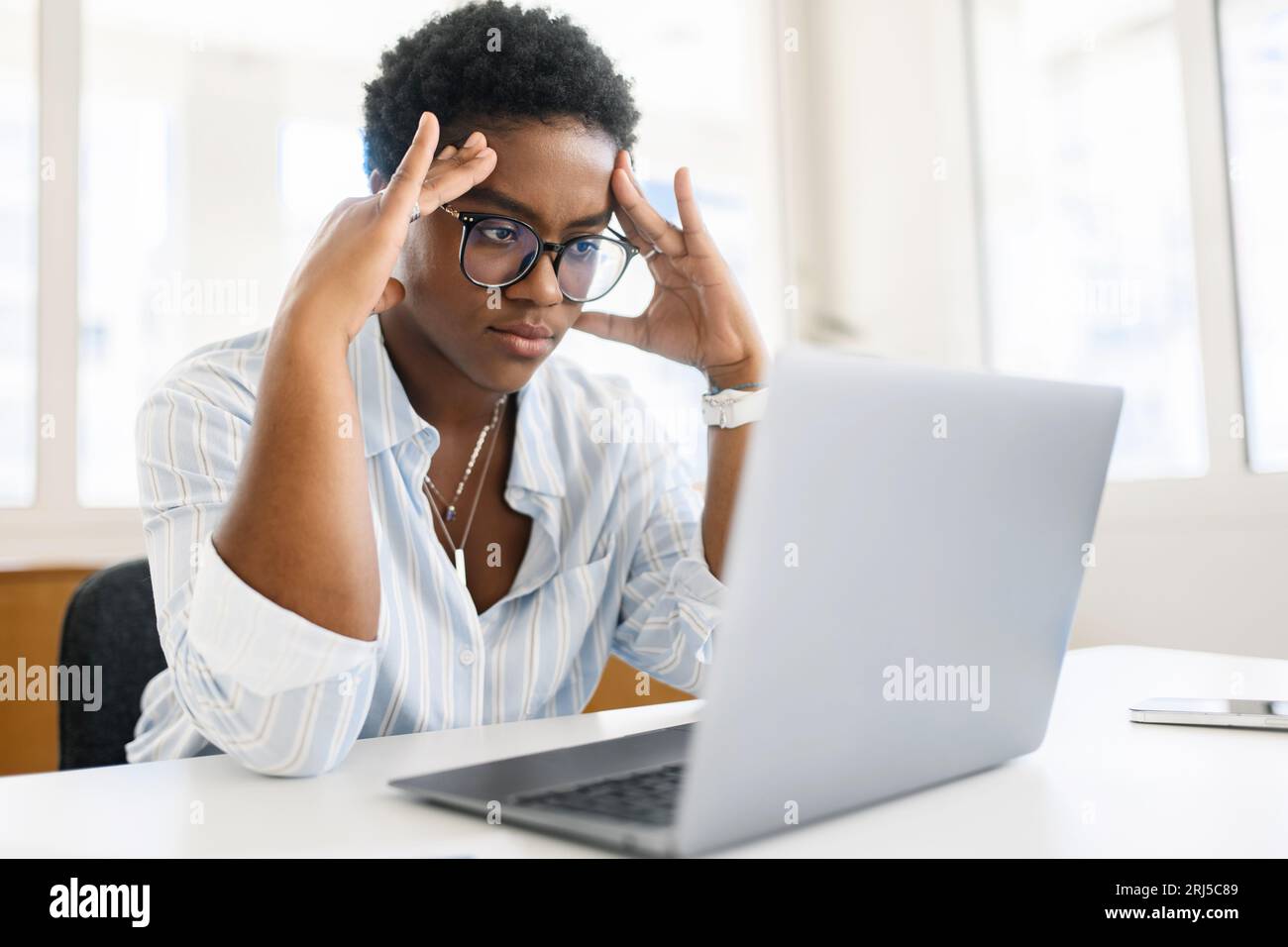 Puzzled by difficult task female programmer thinking about resolving ...