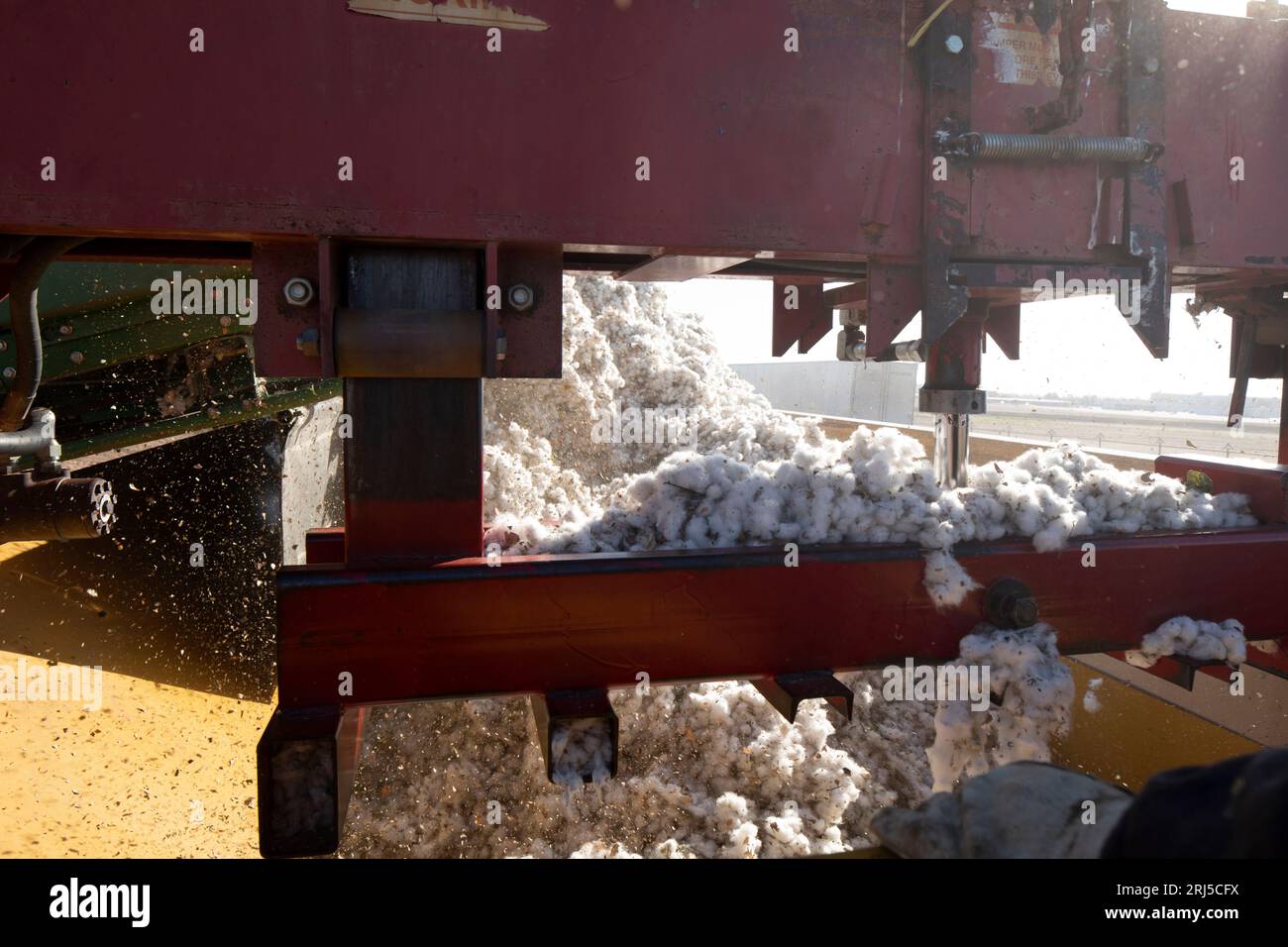 Cotton processing machinery at work outside Stock Photo - Alamy