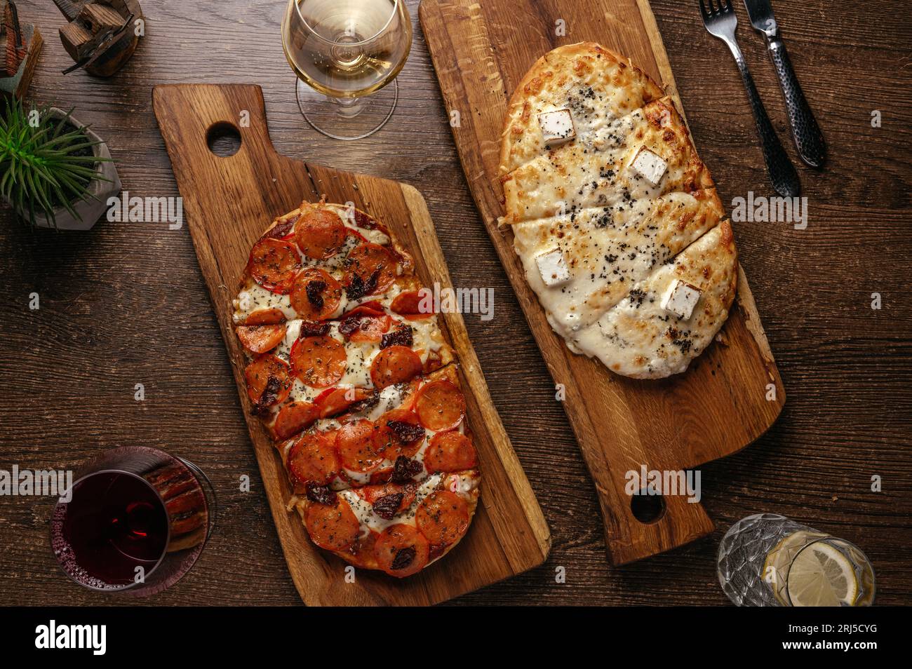 italian pizzetta with sausage on a wooden board. Restaurant menu Stock ...