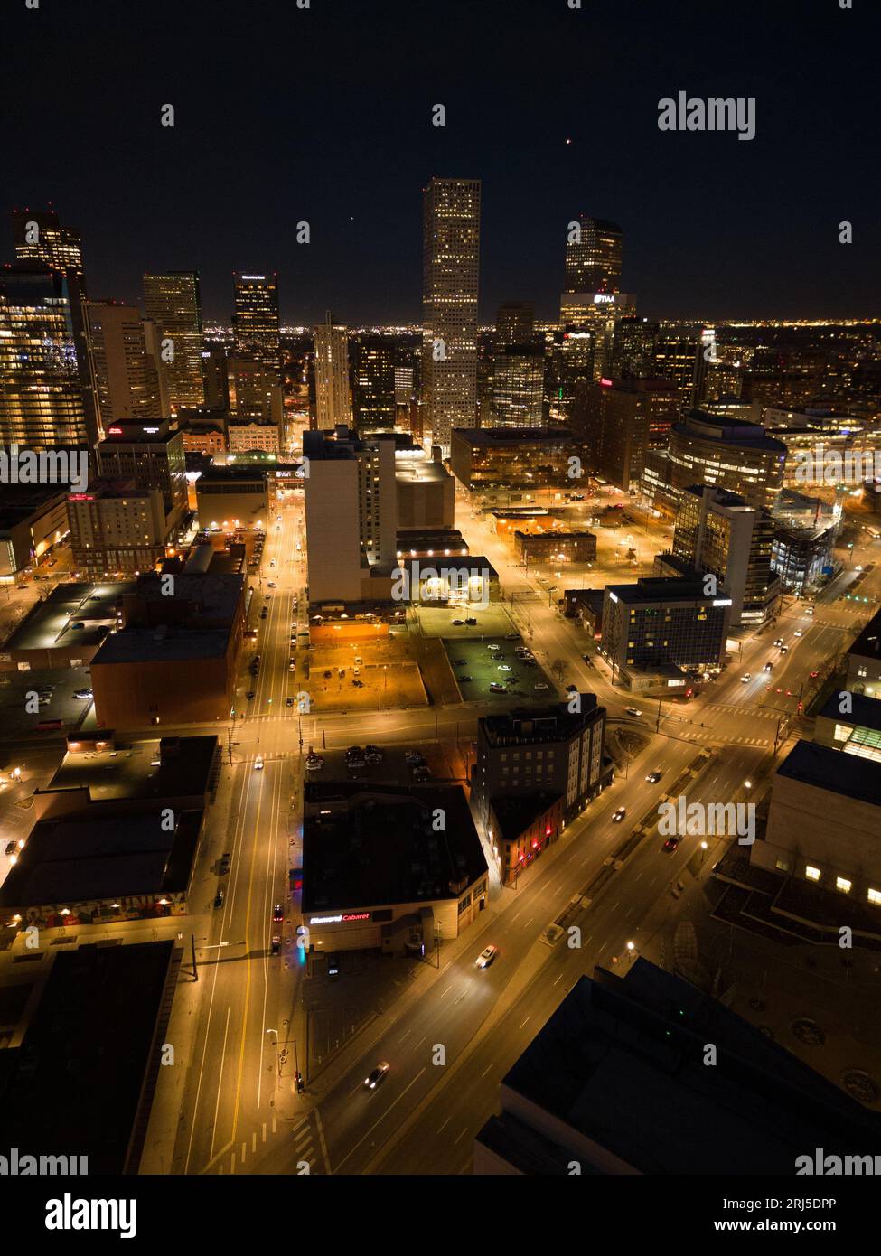 An Aerial shot of Denver at night, with illuminated cityscapes and ...