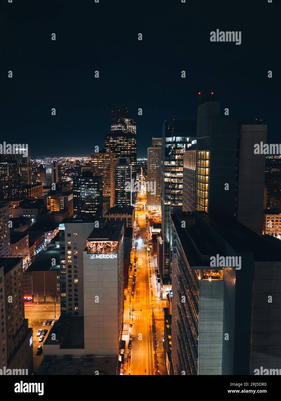 An Aerial shot of Denver at night, with illuminated cityscapes and ...