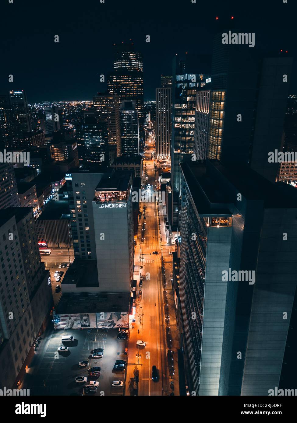An Aerial shot of Denver at night, with illuminated cityscapes and ...
