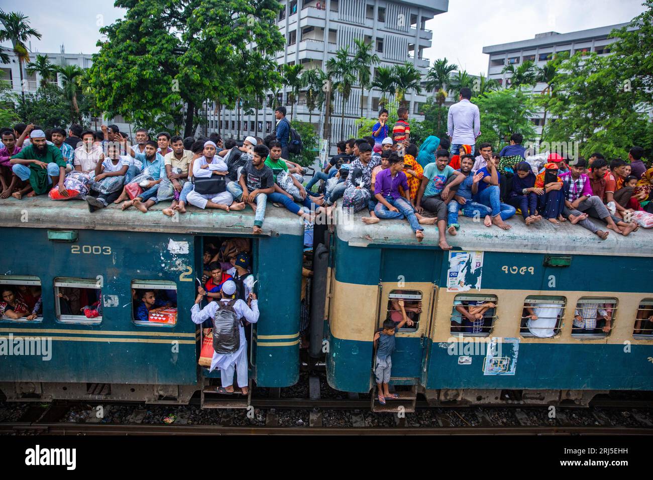 An overcrowded train leaves the Airport Railway Station in Dhaka ahead ...