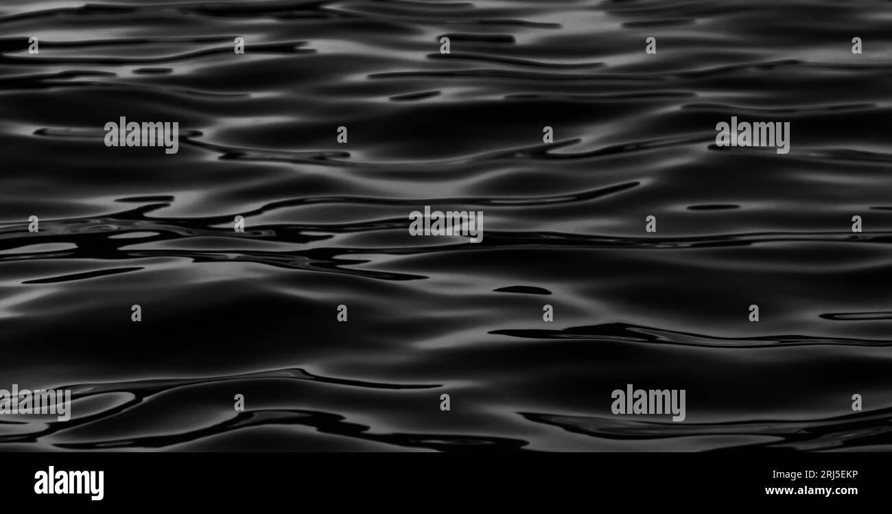 A close-up shot of a black seawater texture Stock Photo - Alamy