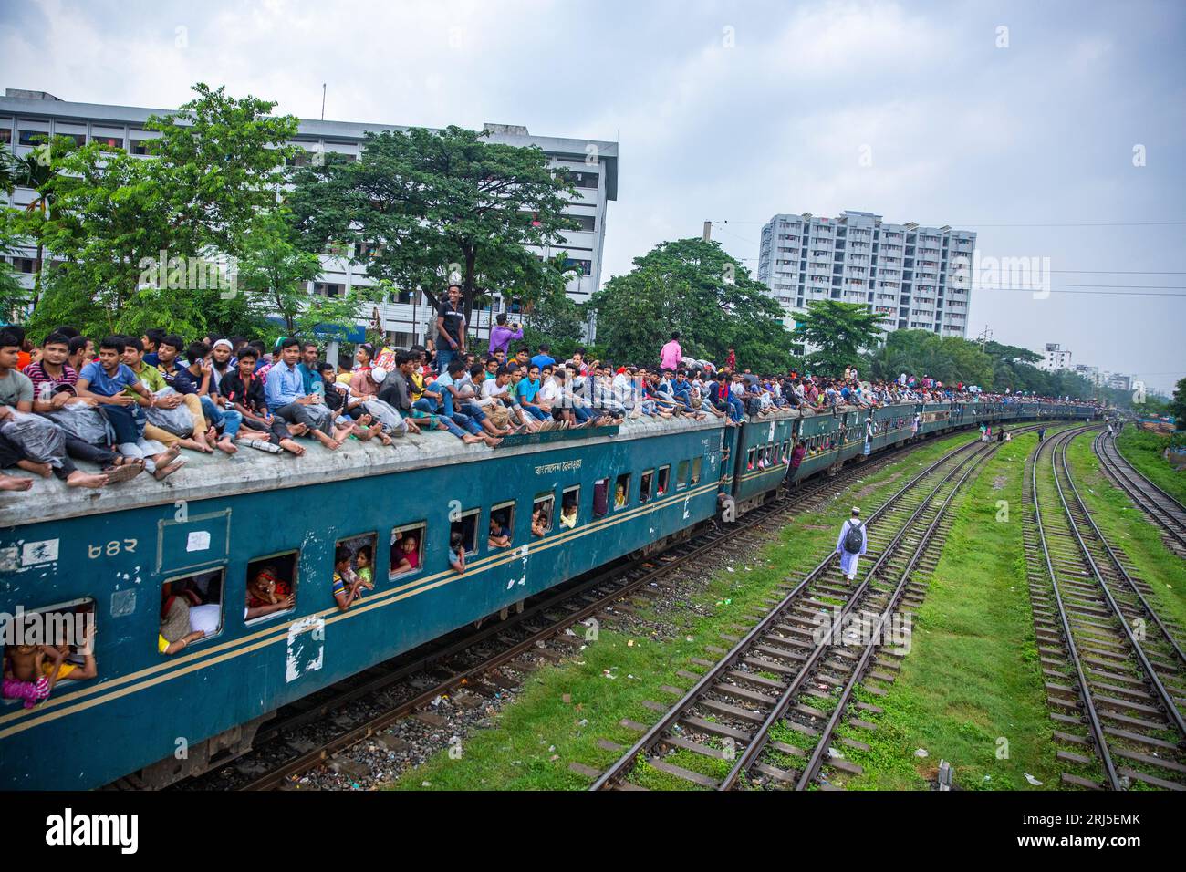 An overcrowded train leaves the Airport Railway Station in Dhaka ahead ...