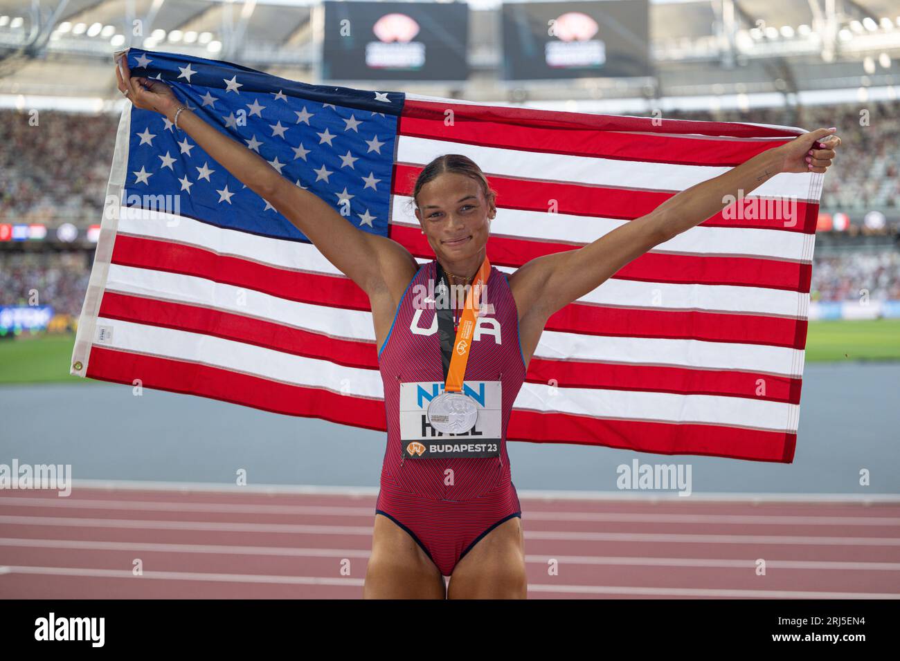 Anna Hall celebrating the second place with her country's flag in the ...