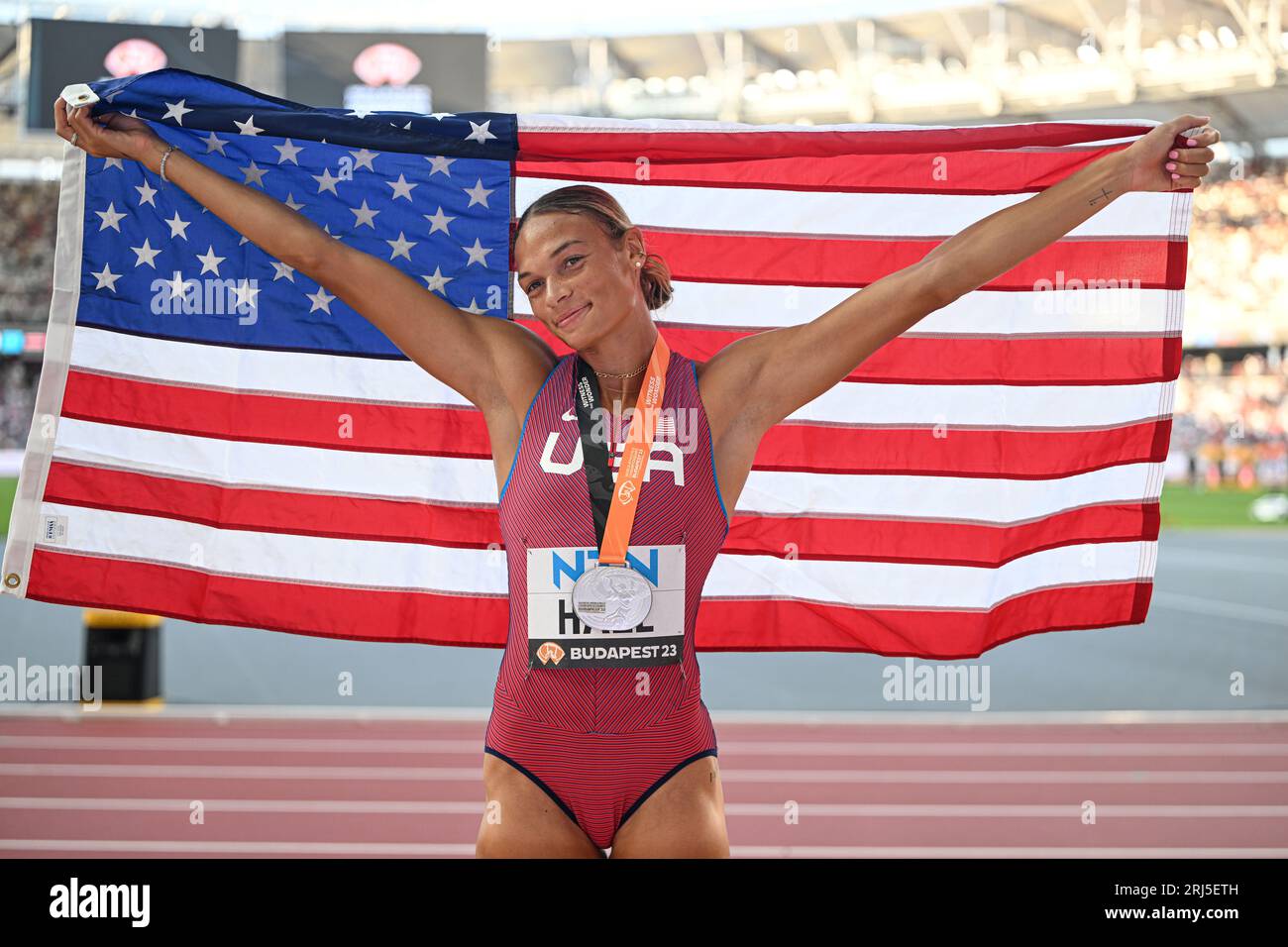 Anna Hall celebrating the second place with her country's flag in the ...