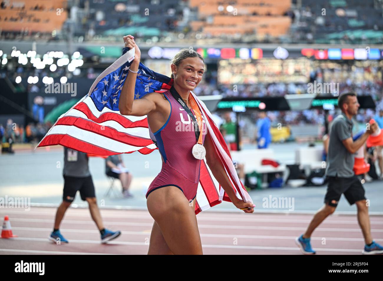Anna Hall celebrating the second place with her country's flag in the ...