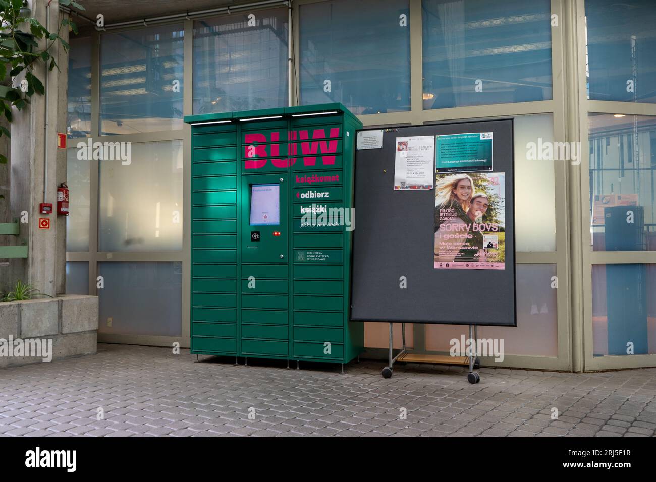 Metal cabinet with cells for contactless lending of books from the ...