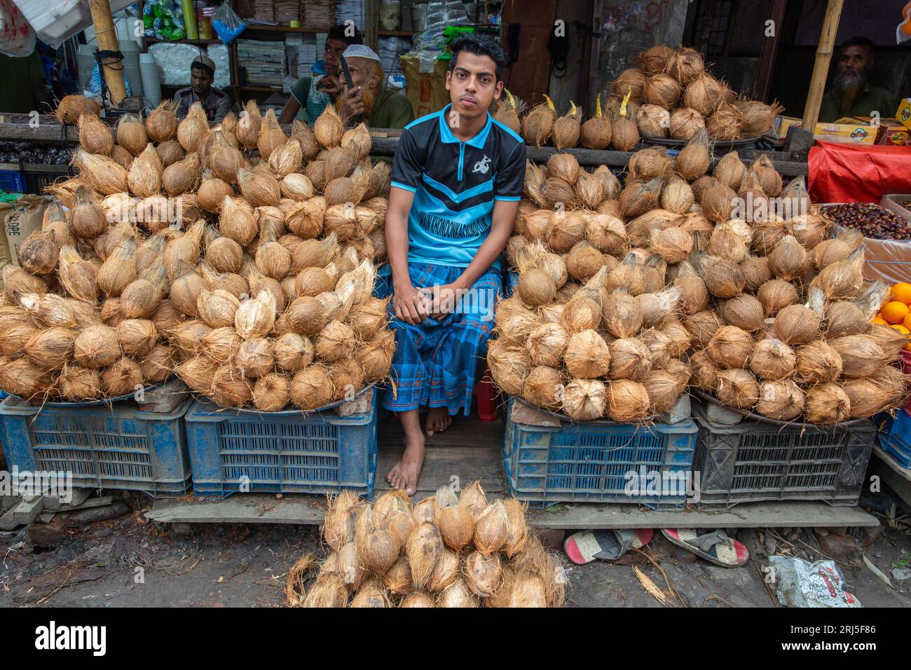 Coconut seller at the Jurain Railgate Market where around 600 hawkers ...