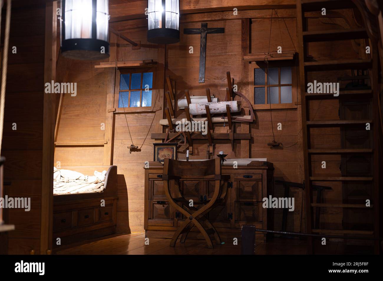 An old cabin room with a desk next to the bed of an old ship Stock ...
