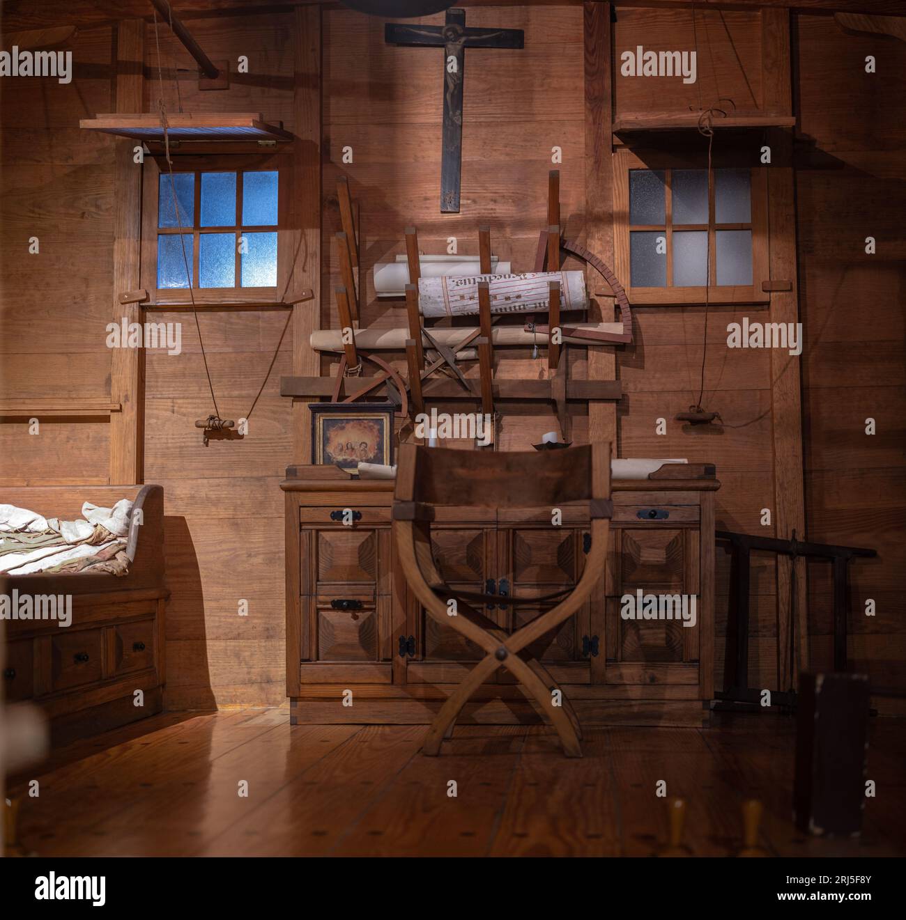 An old cabin room with a desk next to the bed of an old ship Stock ...
